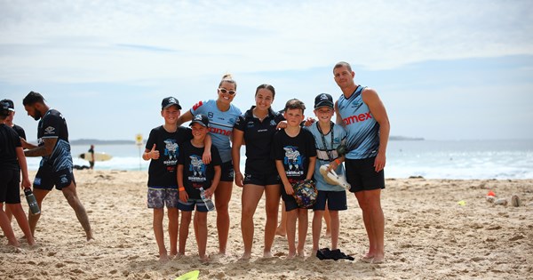Kids flock to beach for Footy and Surf clinic | Sharks